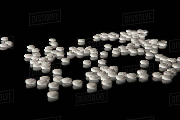 Scattered pills - Stock Photo - Dissolve