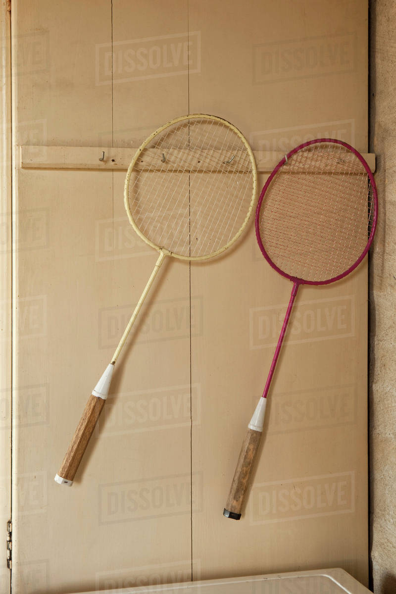Two badminton racquets hanging on a wall - Royalty-free Stock Photo ...