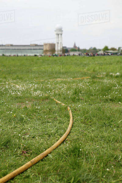 A hose running through a field - Stock Photo - Dissolve