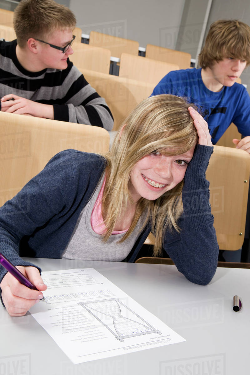 Portrait of a female high school student in class - Stock Photo - Dissolve