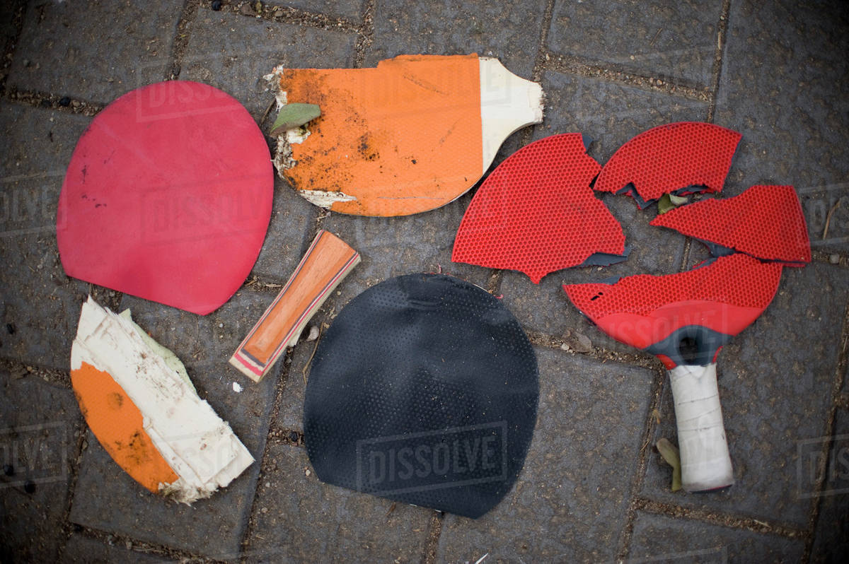 Broken table tennis rackets - Stock Photo - Dissolve