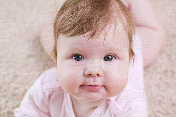 A baby looking at camera, portrait - Royalty-free Stock Photo | Dissolve