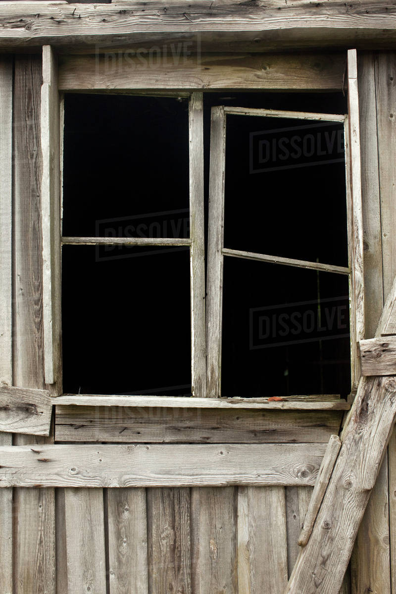 An old broken window frame - Stock Photo - Dissolve