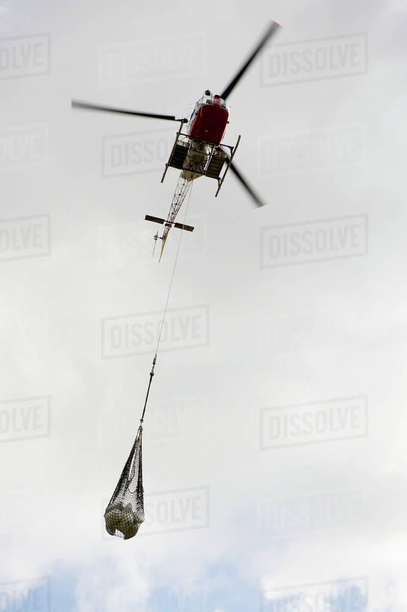 Helicopter carrying bundle - Royalty-free Stock Photo | Dissolve