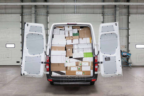 Boxes loaded in van at factory - Stock Photo - Dissolve
