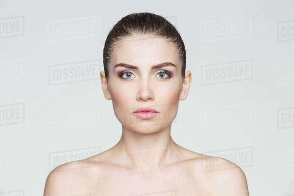 Portrait of shirtless woman against white background - Royalty-free ...