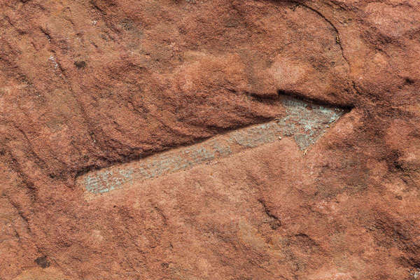 Full frame shot of arrow symbol on brown rock - Royalty-free Stock ...