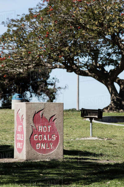 Container for HOT COALS ONLY in park during sunny day - Royalty-free ...