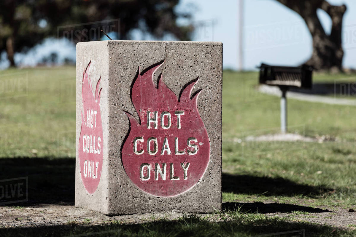 Container for HOT COALS ONLY in park during sunny day - Royalty-free ...