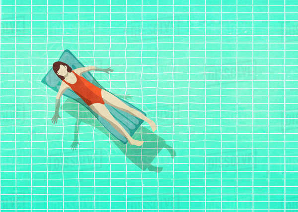 Woman in bathing suit laying on inflatable raft in swimming pool ...