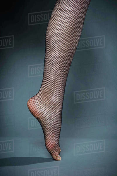 Womans leg in fishnet stocking - Royalty-free Stock Photo | Dissolve