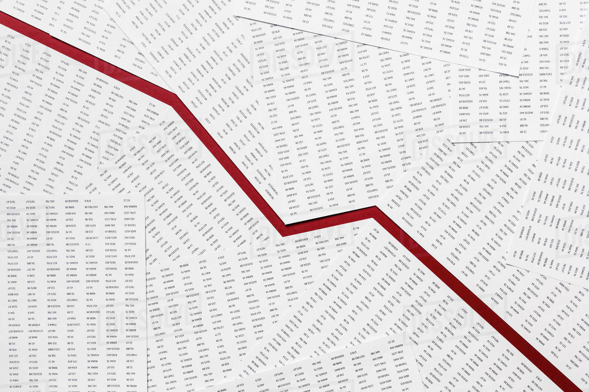 View from above red descending line through paperwork - Stock Photo ...