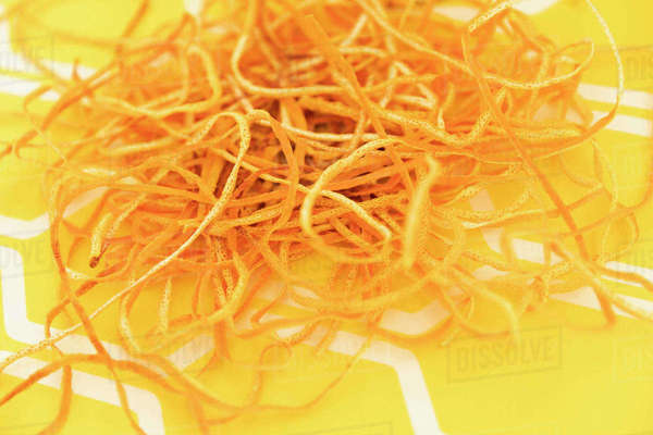 Close up vibrant orange zest strings - Royalty-free Stock Photo | Dissolve