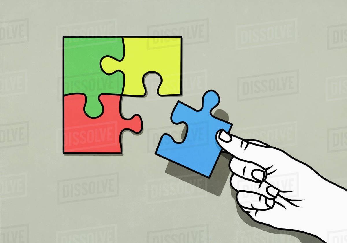 Hand completing puzzle with missing piece - Stock Photo - Dissolve