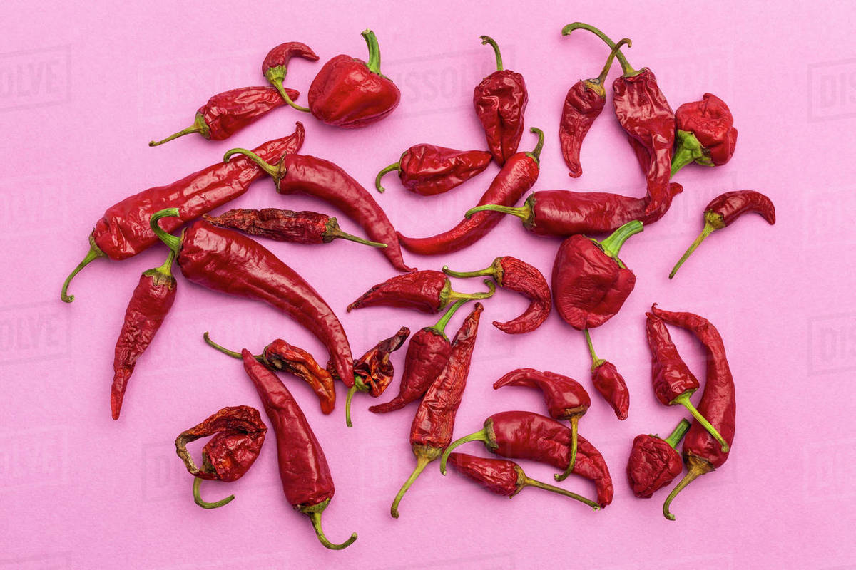 Red chili peppers on bright pink background - Royalty-free Stock Photo ...