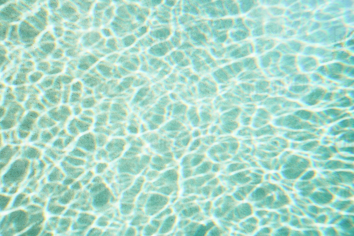 Reflection forming pattern over blue swimming pool water - Royalty-free ...