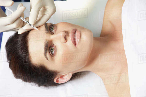 Woman Receiving Botox Injection on Forehead - Royalty-free Stock Photo ...