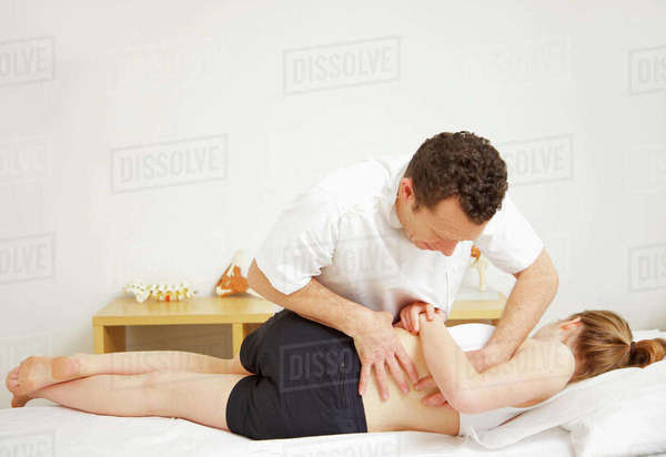 Osteopath Treating Female Patient - Royalty-free Stock Photo | Dissolve