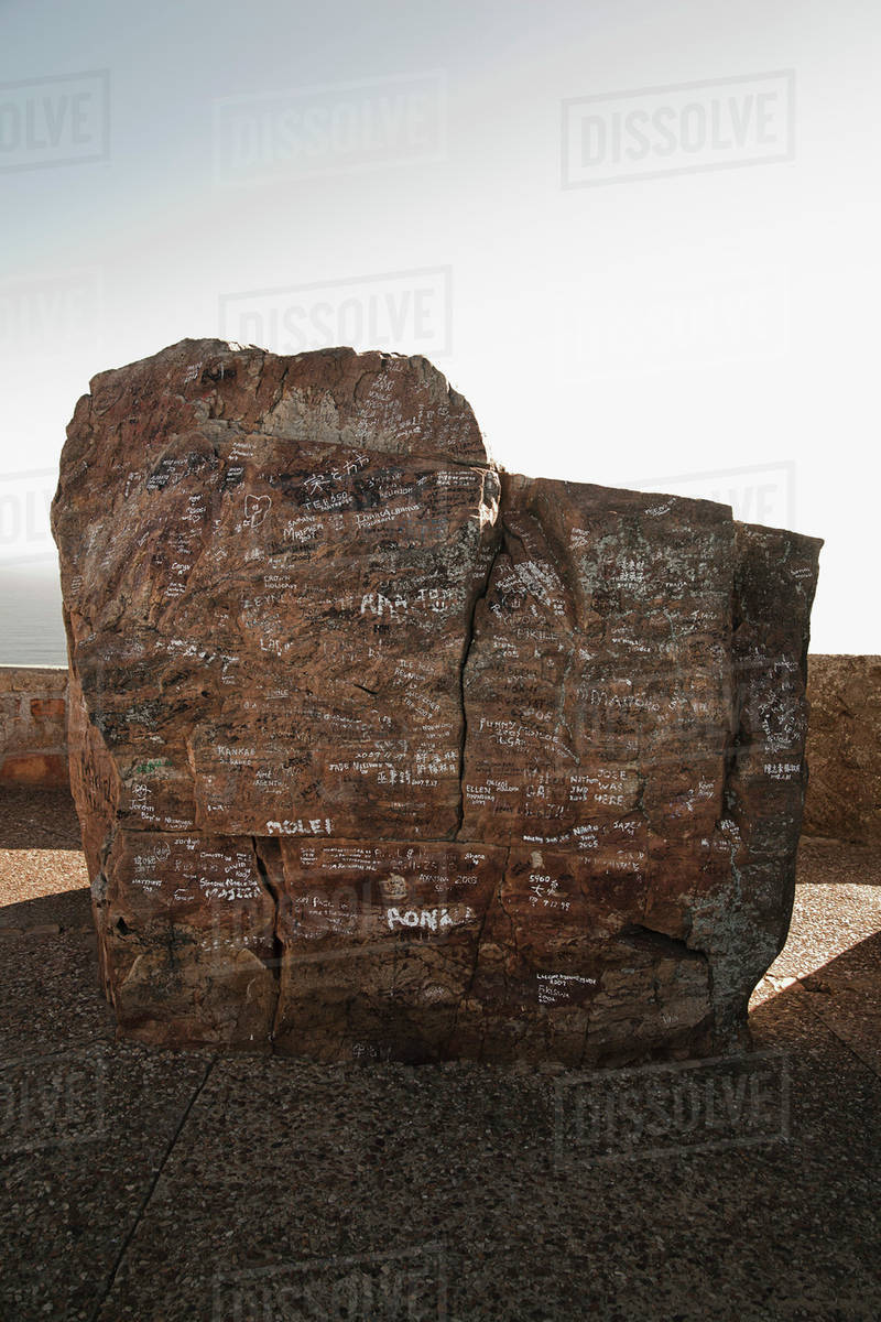 Boulder with written messages on it and surrounding wall in the ...