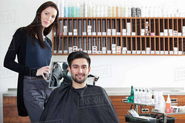 A happy customer in a hair salon - Stock Photo - Dissolve