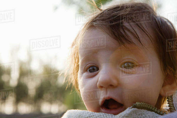 A baby staring into the camera - Royalty-free Stock Photo | Dissolve